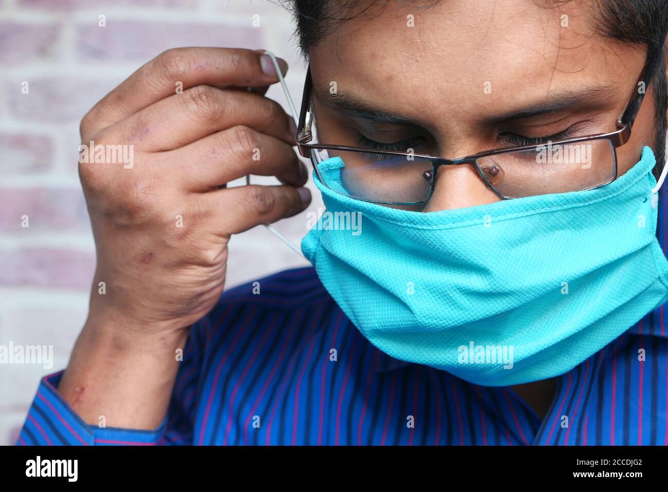 A young man with protective mask in face Stock Photo - Alamy