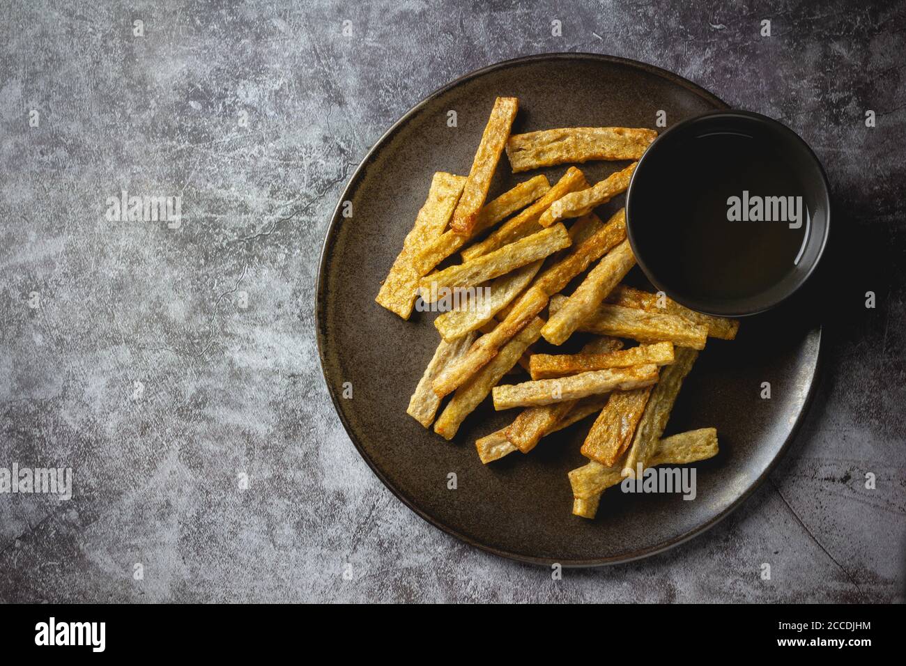 fried fish snacks called Keropok Lekor on concrete Background Stock ...