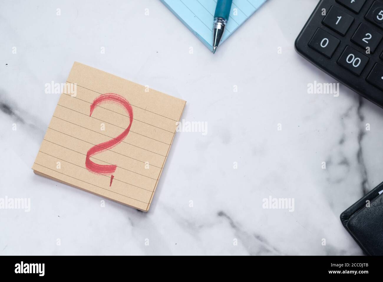 high angle view of question mark on paper on office desk Stock Photo ...
