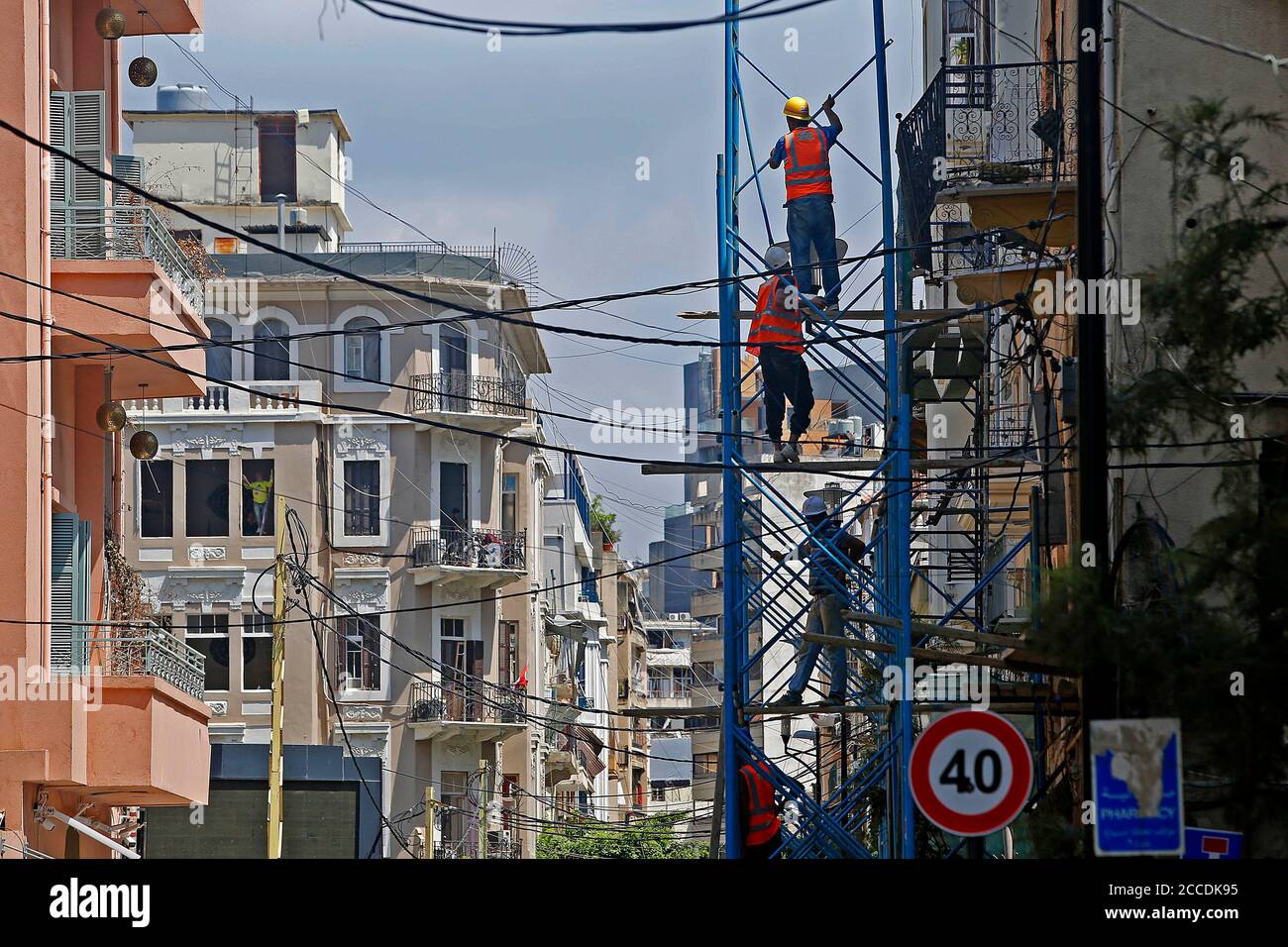 Beirut, Lebanon. 21st Aug, 2020. Workers repair buildings damaged ...