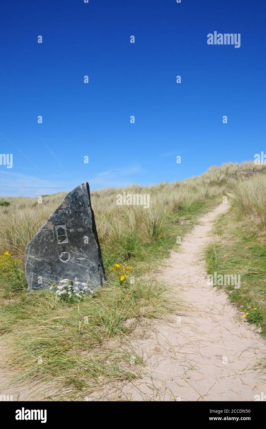 Carved rock direction marker for the south west coast path as it ...