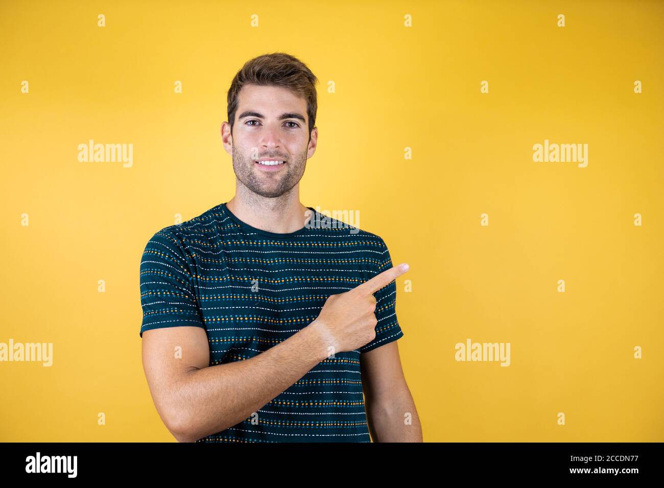 Young handsome man over isolated background smiling with happy face ...