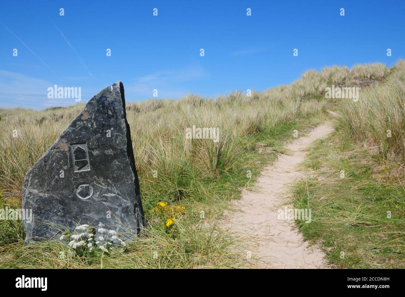 Carved rock direction marker for the south west coast path as it ...