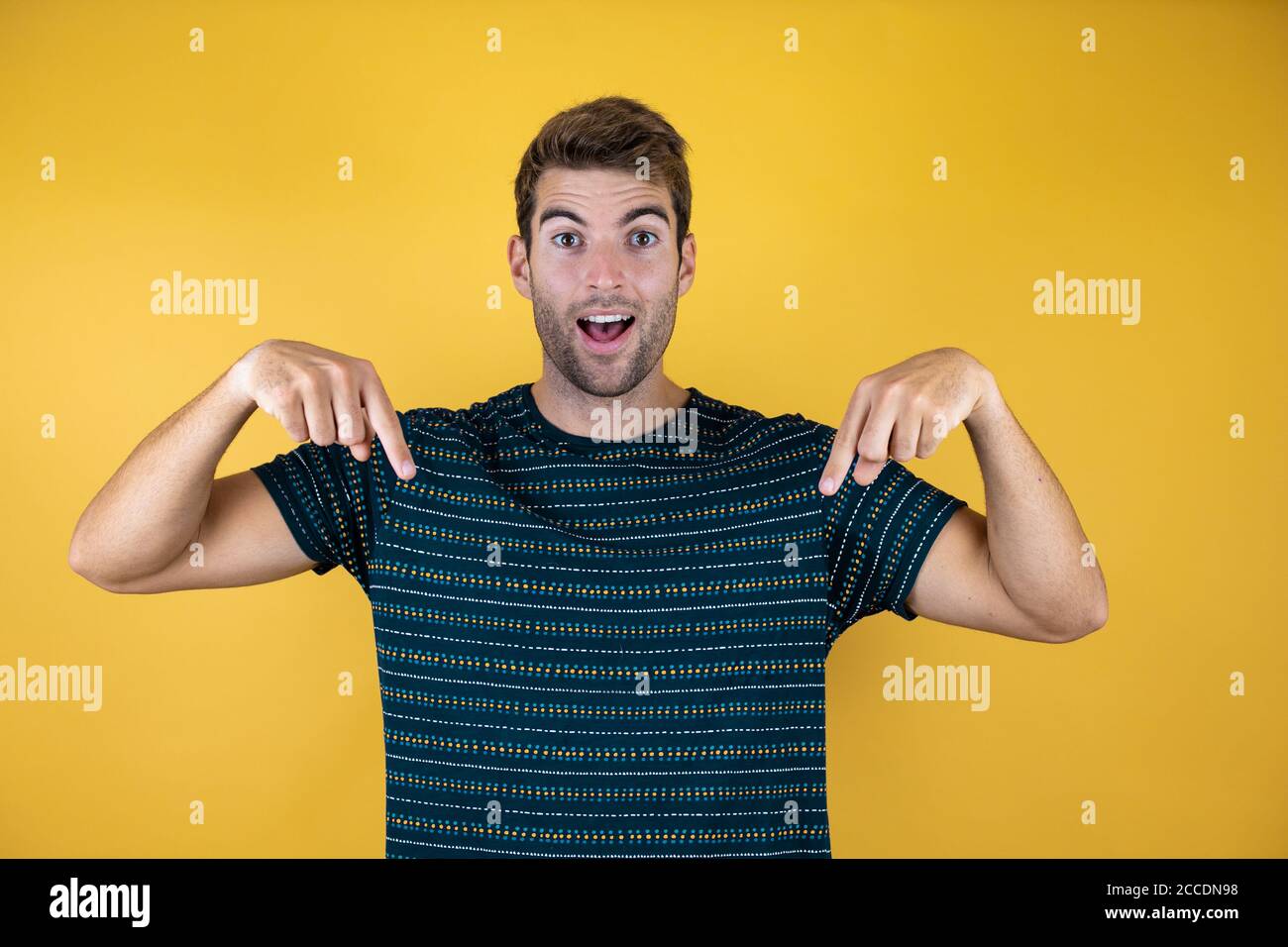Young handsome man over isolated background amazed smiling with happy ...