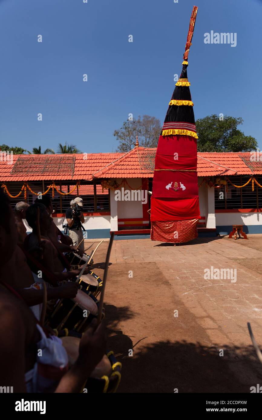 A Theyyam artist performs traditional rituals at a Kerala temple Stock ...