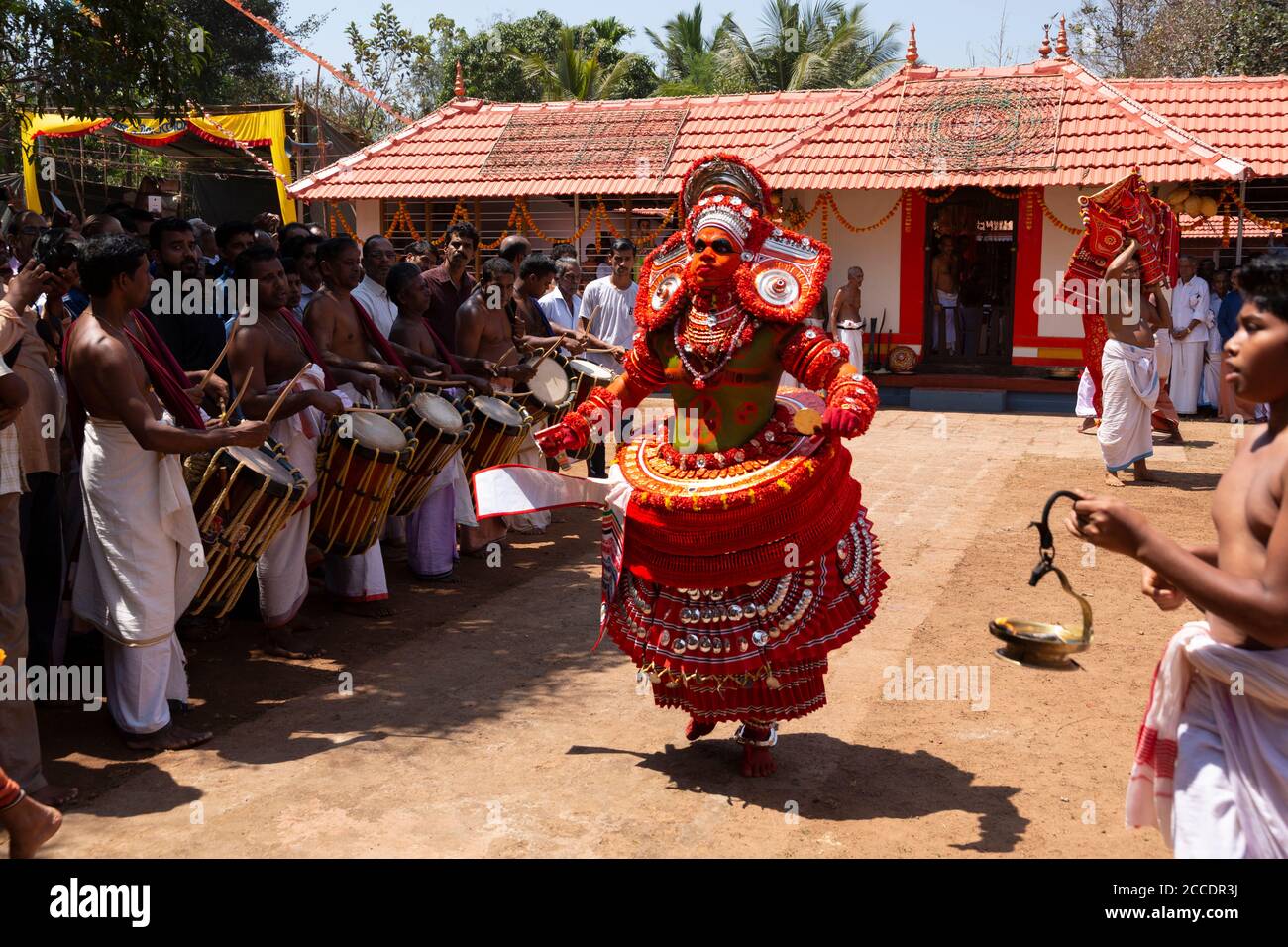 A Theyyam artist performs traditional rituals at a Kerala temple Stock ...