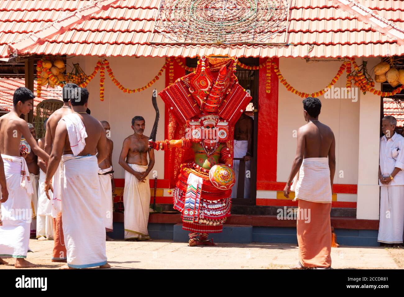 A Theyyam artist performing a ritual dance in a Kerala Temple Stock ...