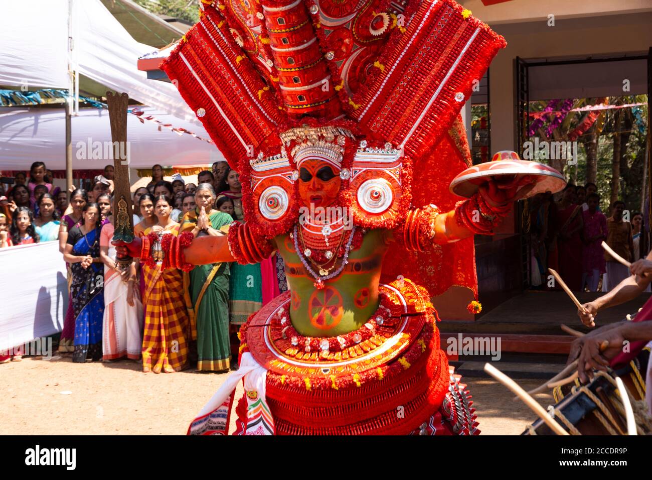 A Theyyam artist performing a ritual dance in a Kerala Temple Stock ...