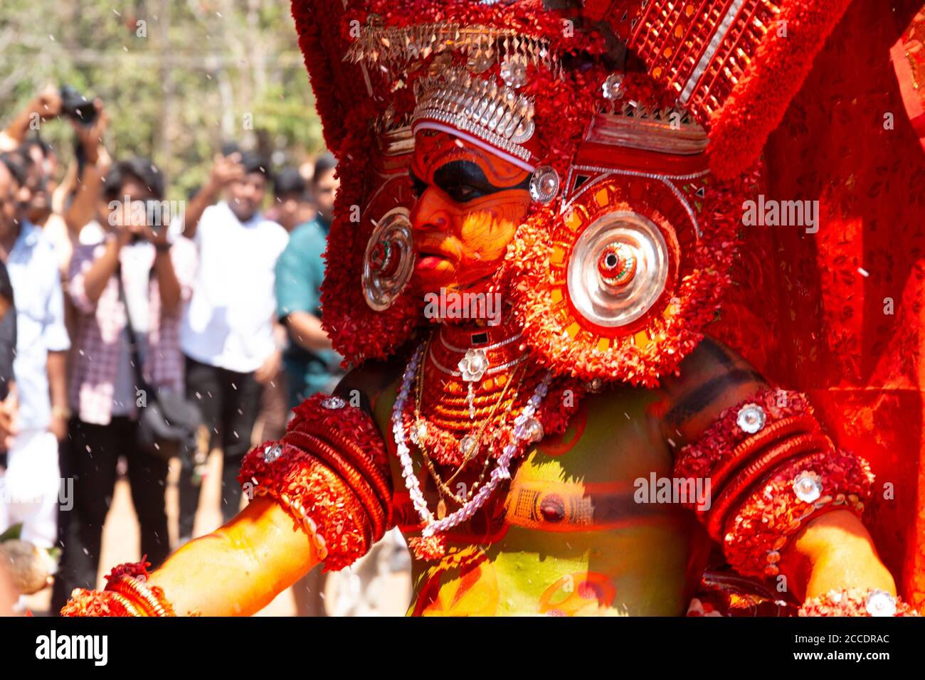 A Theyyam artist performing a ritual dance in a Kerala Temple Stock ...