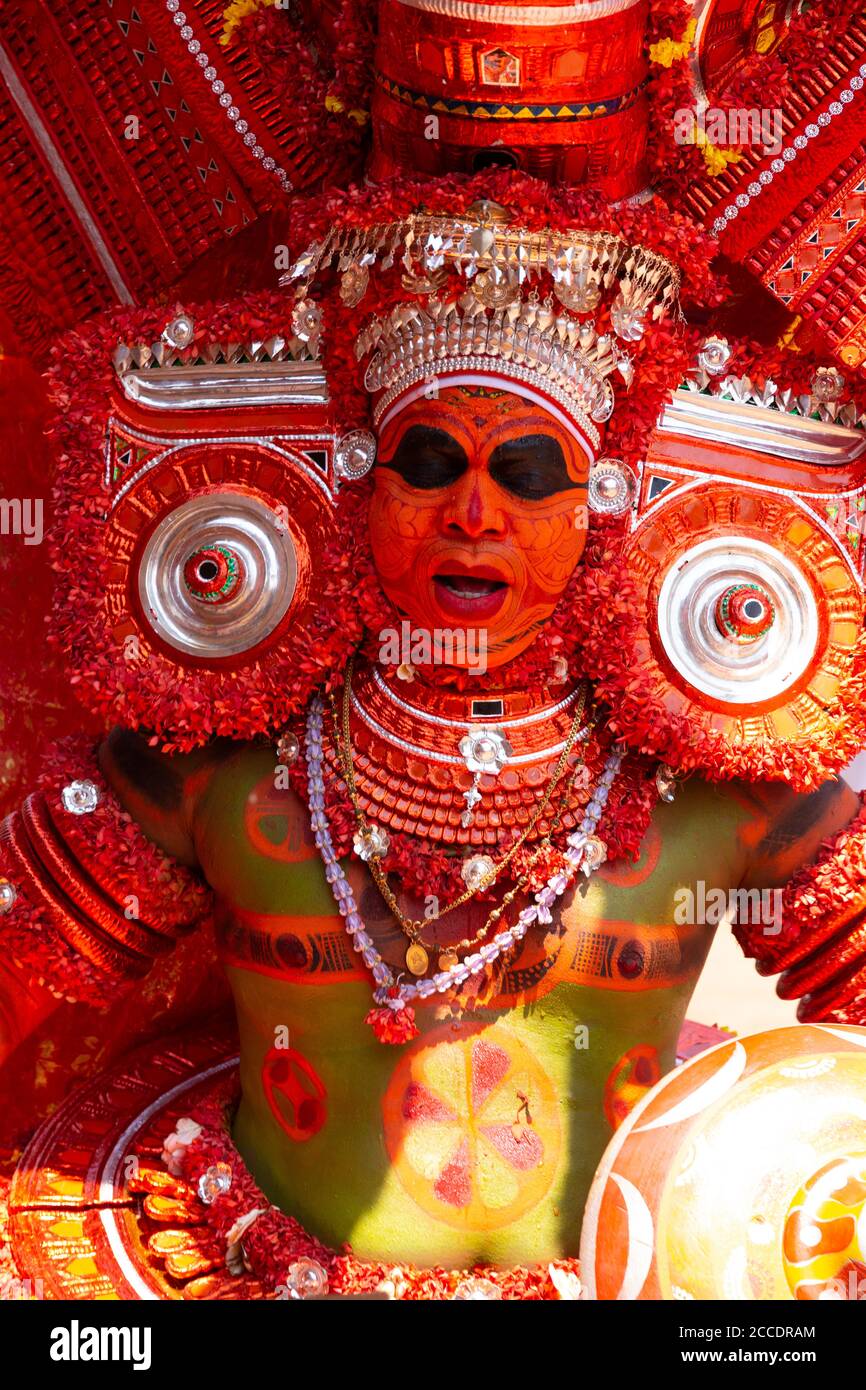 A Theyyam artist performing a ritual dance in a Kerala Temple Stock ...