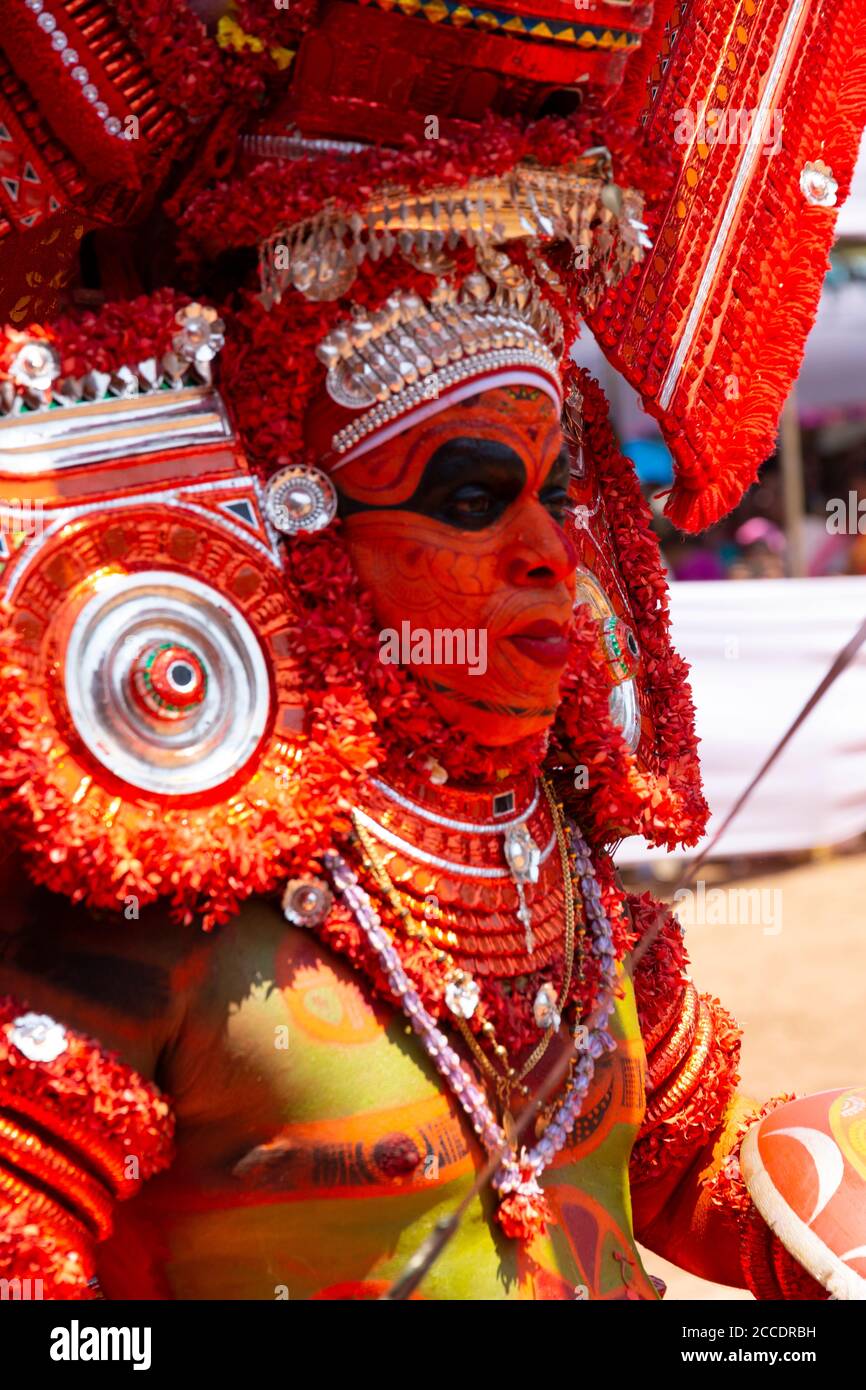 A Theyyam artist performing a ritual dance in a Kerala Temple Stock ...