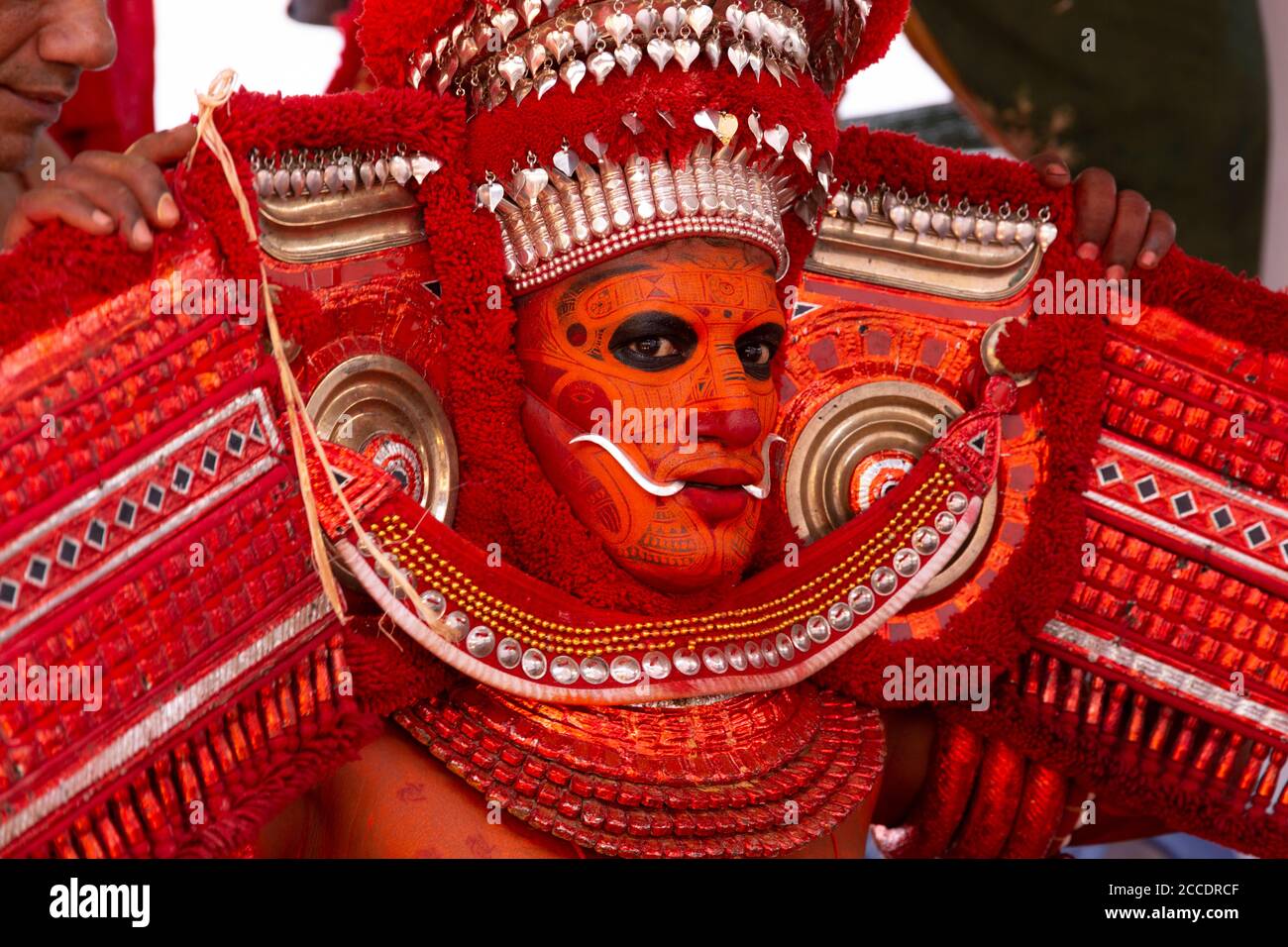 A Theyyam artist performing a ritual dance in a Kerala Temple Stock ...