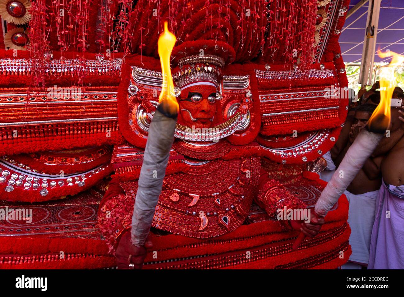 Traditional Theyyam performer adorned in elaborate costume and makeup ...