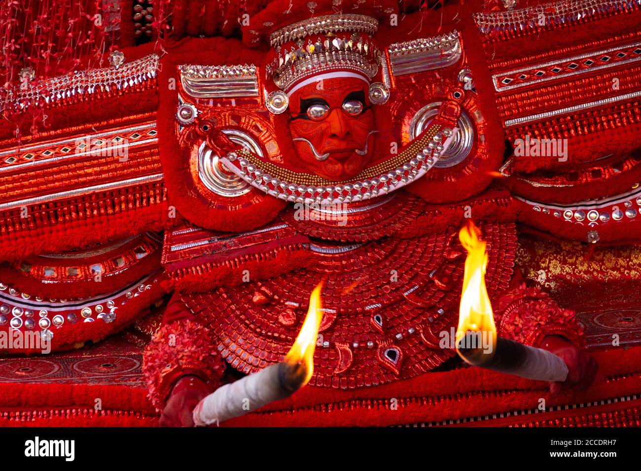 Traditional Theyyam performer adorned in elaborate costume and makeup ...
