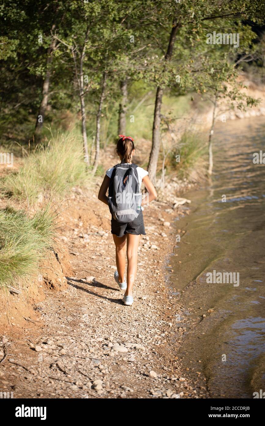Girl wearing a backpack hi-res stock photography and images - Alamy