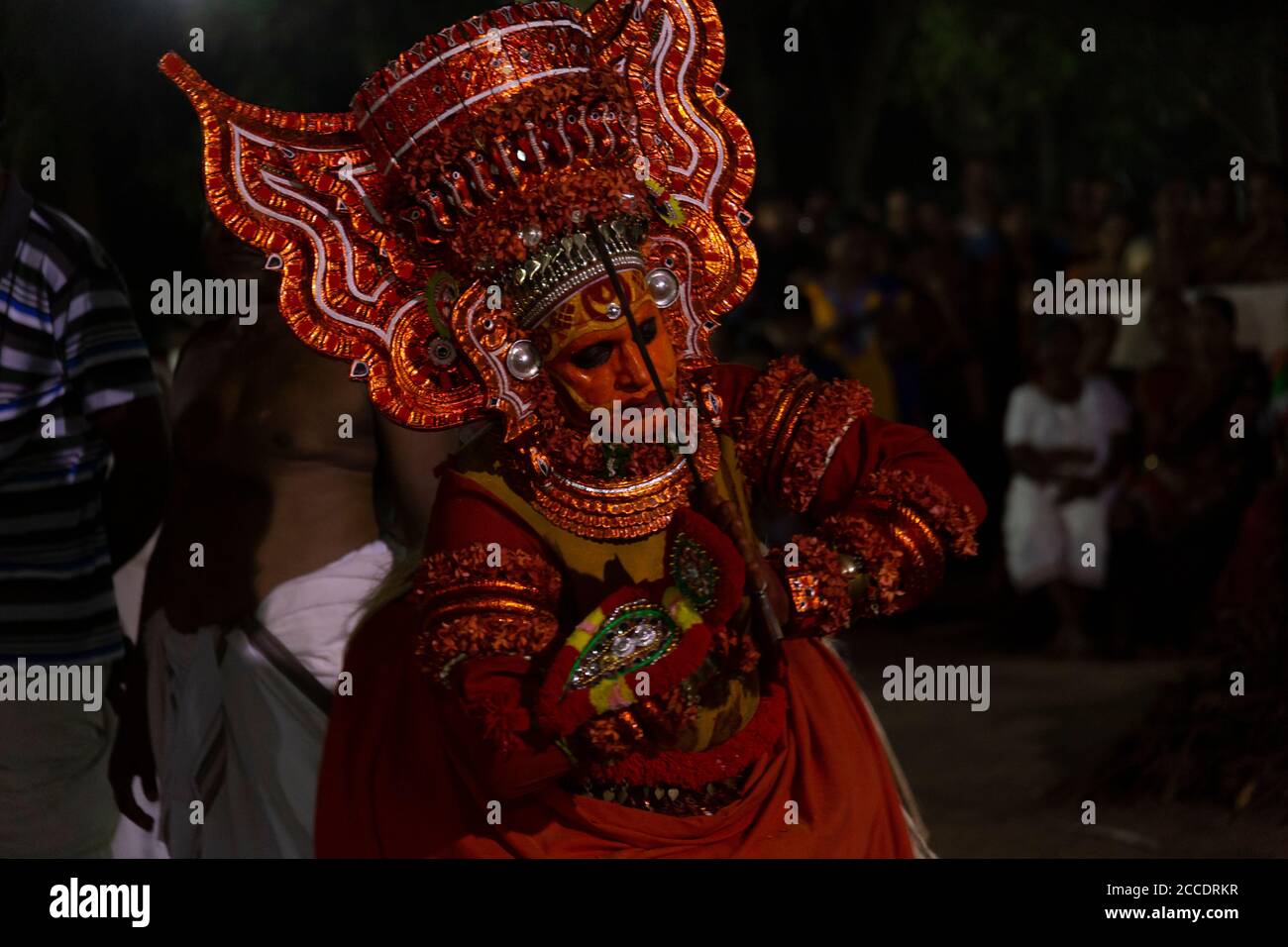 Traditional Theyyam performer adorned in elaborate costume and makeup ...