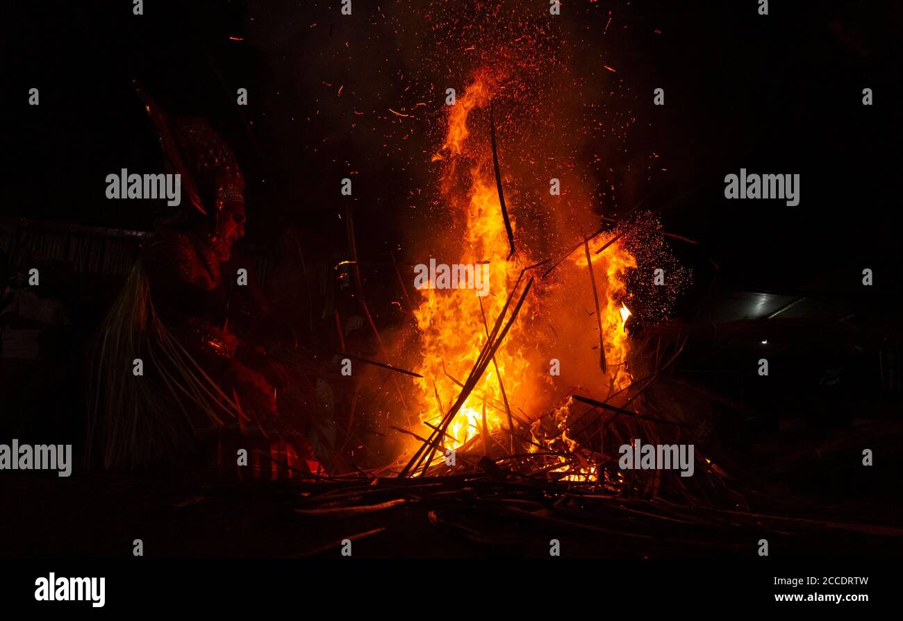 Kandanar Kelan Theyyam of northern Kerala, India jumping through fire ...