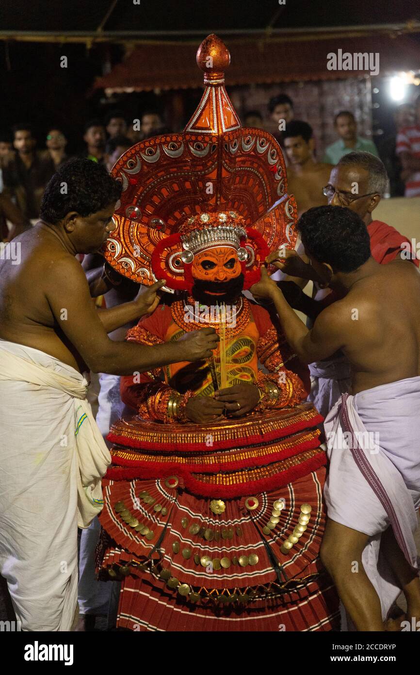 A Theyyam artist performing a ritual dance in a Kerala Temple Stock ...