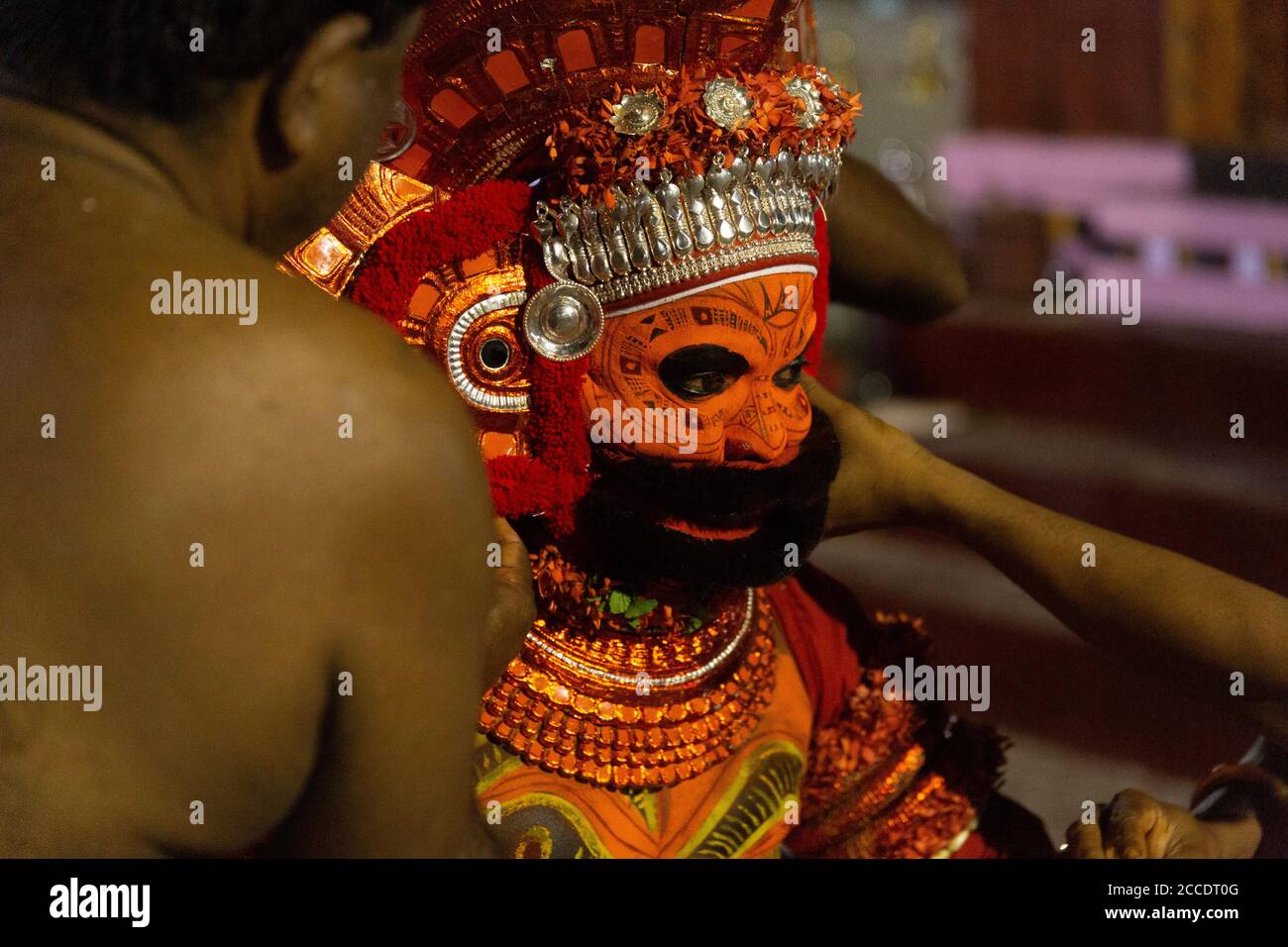 A Theyyam artist performing a ritual dance in a Kerala Temple Stock ...