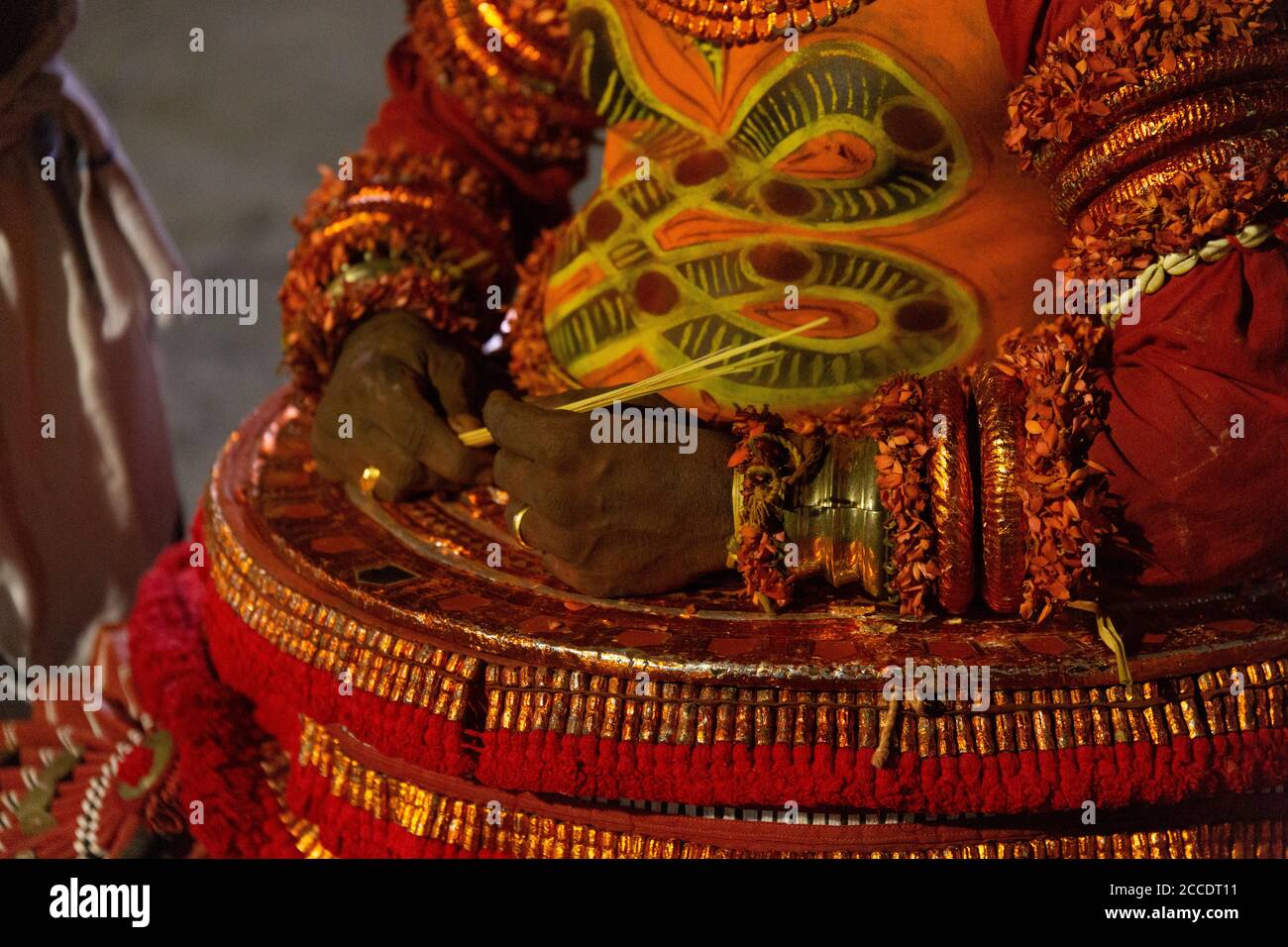 A Theyyam artist performing a ritual dance in a Kerala Temple Stock ...