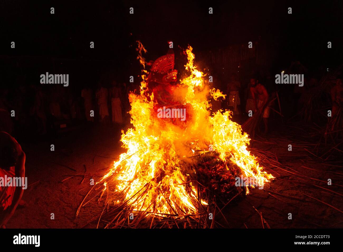 Kandanar Kelan Theyyam of northern Kerala, India jumping through fire ...