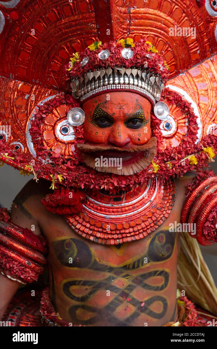 A Theyyam artist performing a ritual dance in a Kerala Temple Stock ...