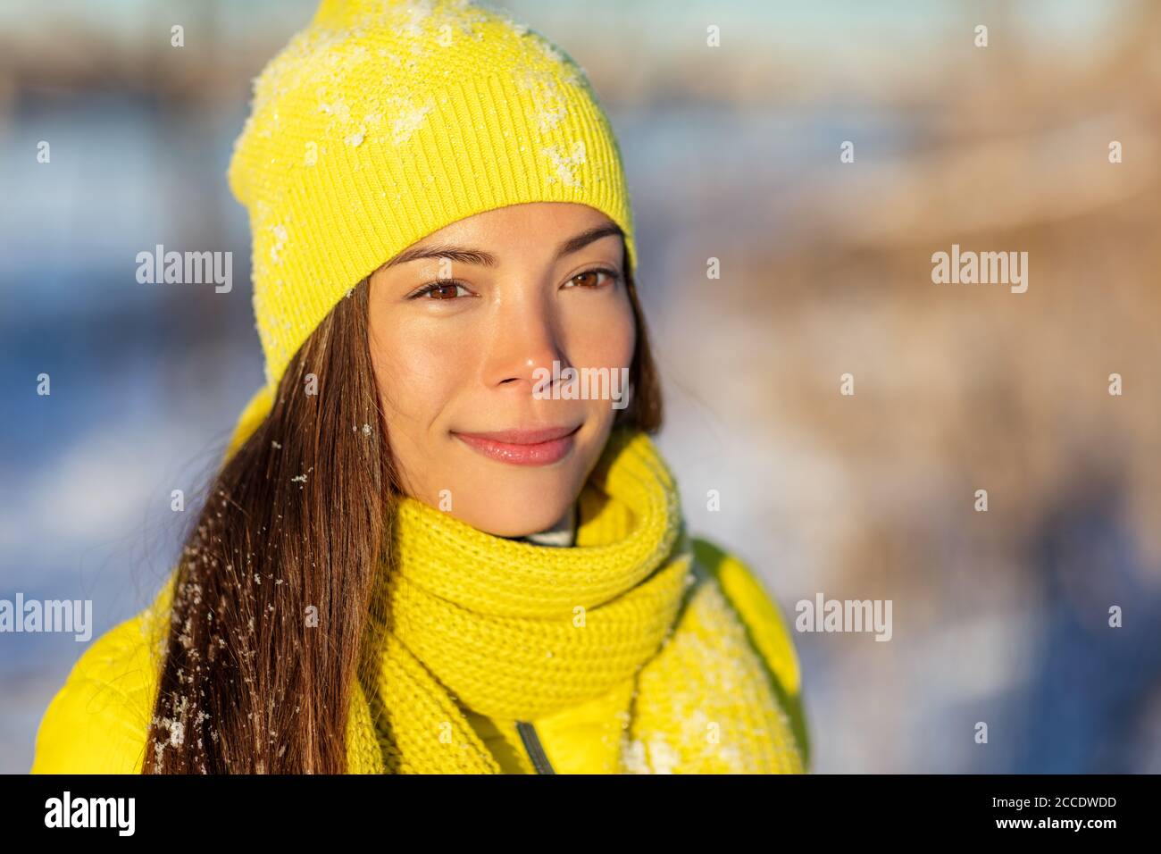 Winter woman Asian beauty girl walking in snow outside with yellow ...