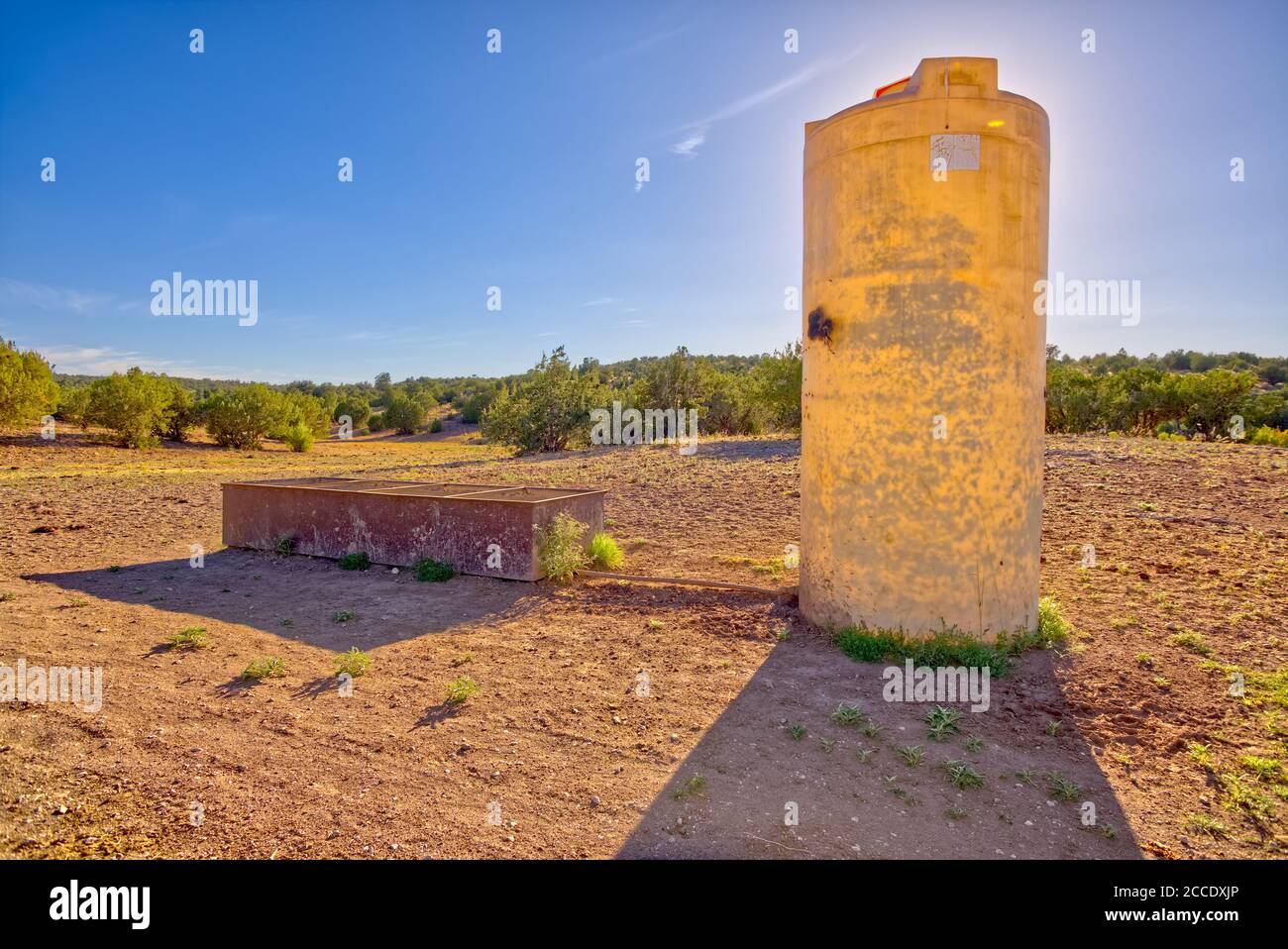 A tall water storage tank for a watering trough at the Dam Cattle Tank ...