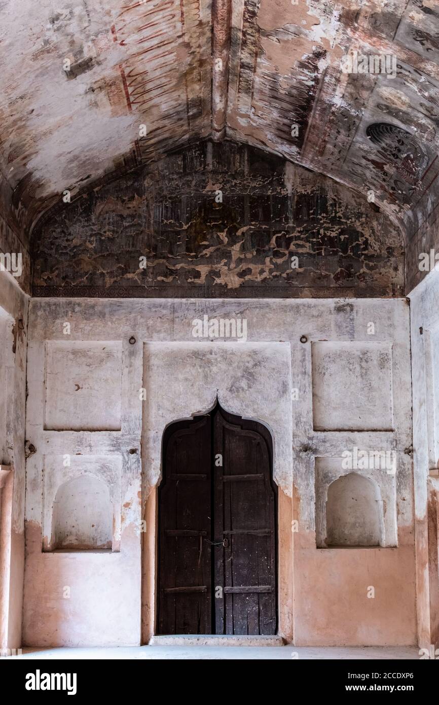 Orchha, Madhya Pradesh, India - March 2019: The faded walls with arched ...