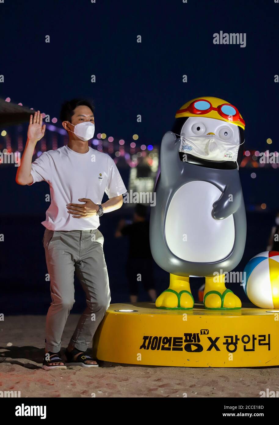 Busan, South Korea. 21st Aug, 2020. A man took a pose with a statue of ...