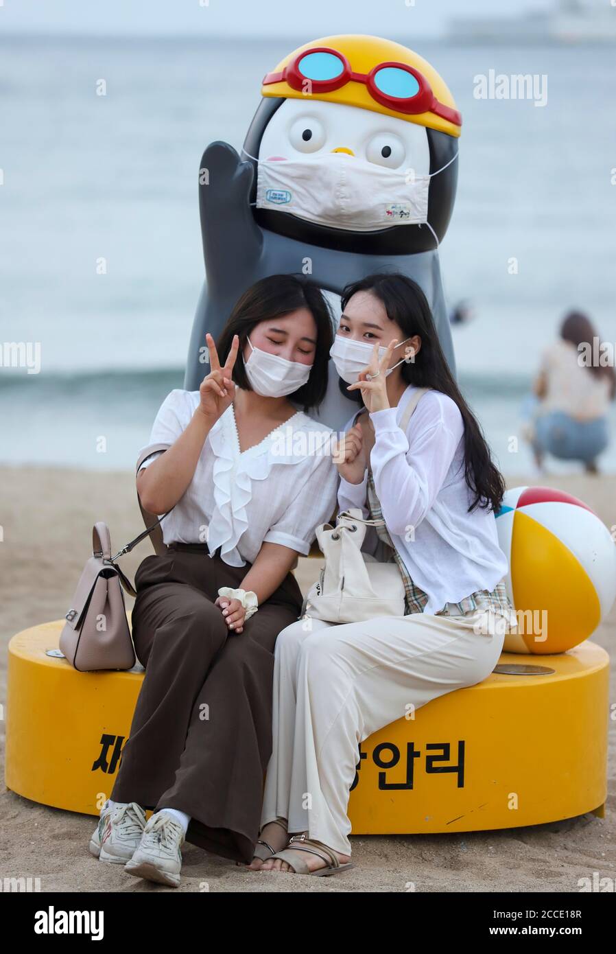 Busan, South Korea. 21st Aug, 2020. Visitors wearing masks taking poses ...