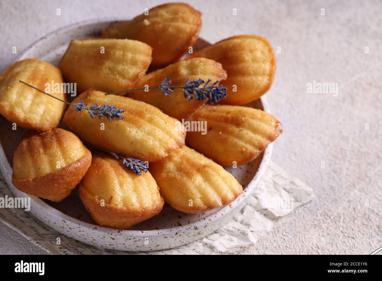 french traditional madeleine biscuits with lavender Stock Photo - Alamy