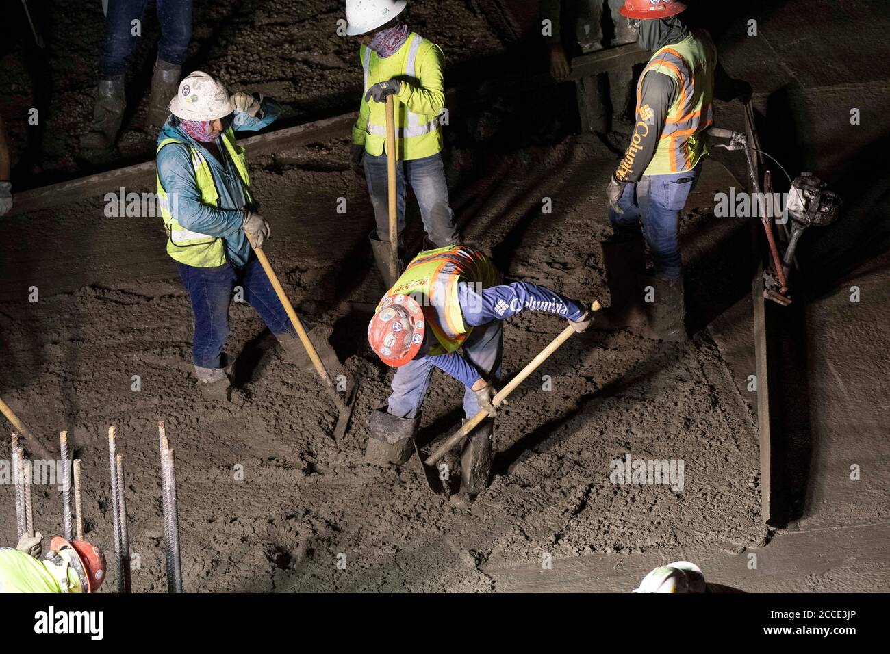 Austin, TX USA July 25, 2020: Concrete crew works quickly to spread ...