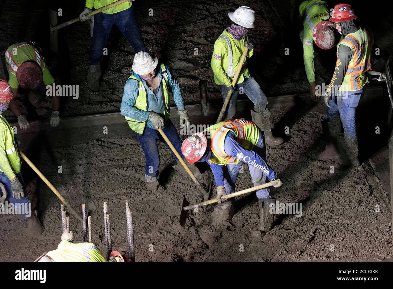 Austin, TX USA July 25, 2020: Concrete crew works quickly to spread ...
