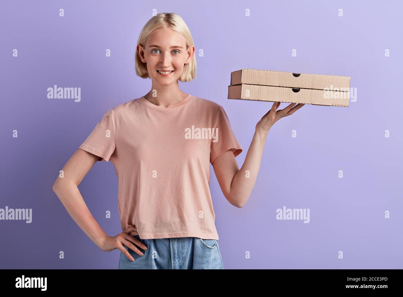 beautiful shop assistant offers pizza to customers, close up portrait ...