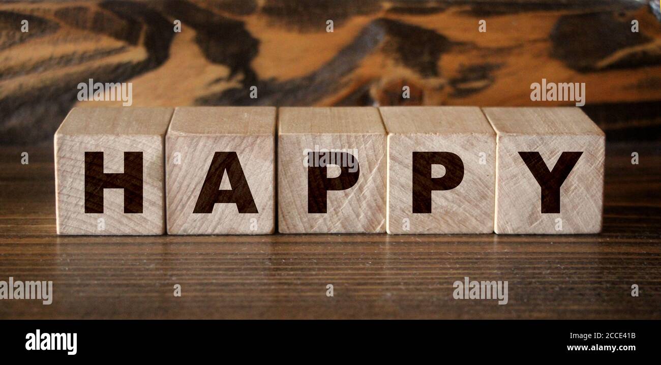 Happy Word Written In Wooden Cubes Stock Photo - Alamy