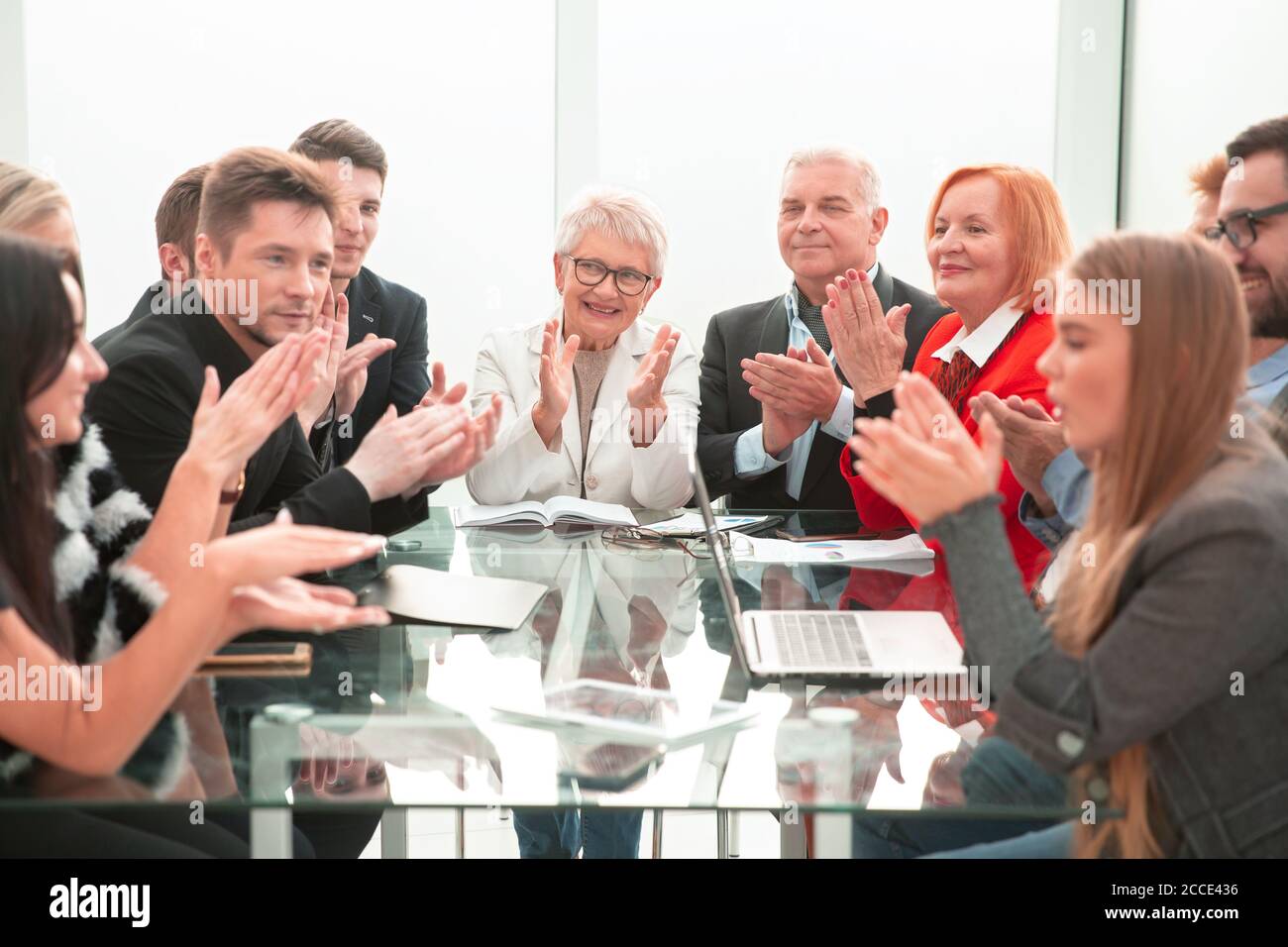 Business team clapping in boardroom hi-res stock photography and images ...