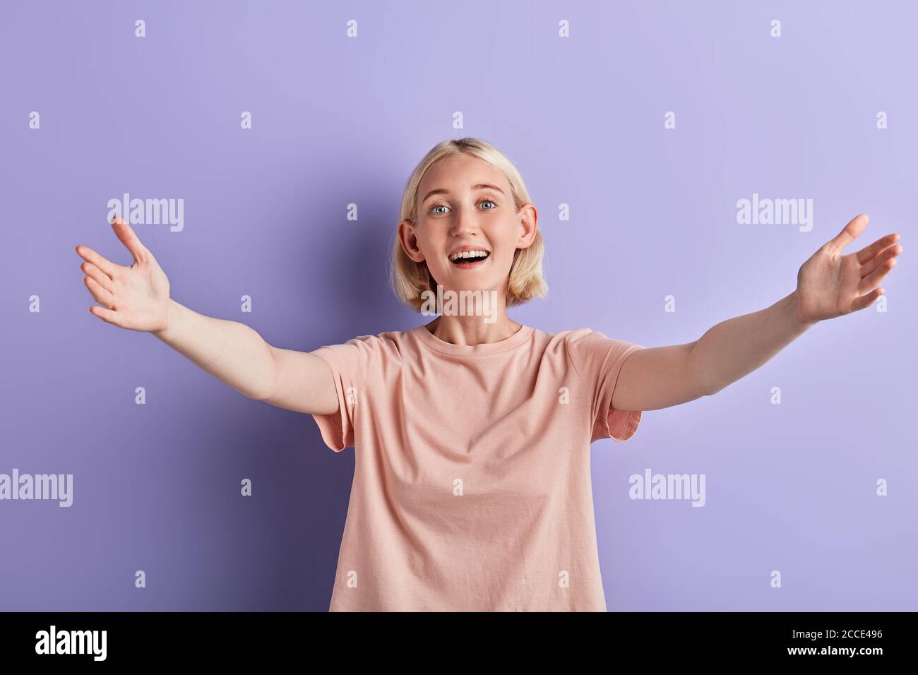 cheerful happy attractive girl greeting friends in the party. kindness ...
