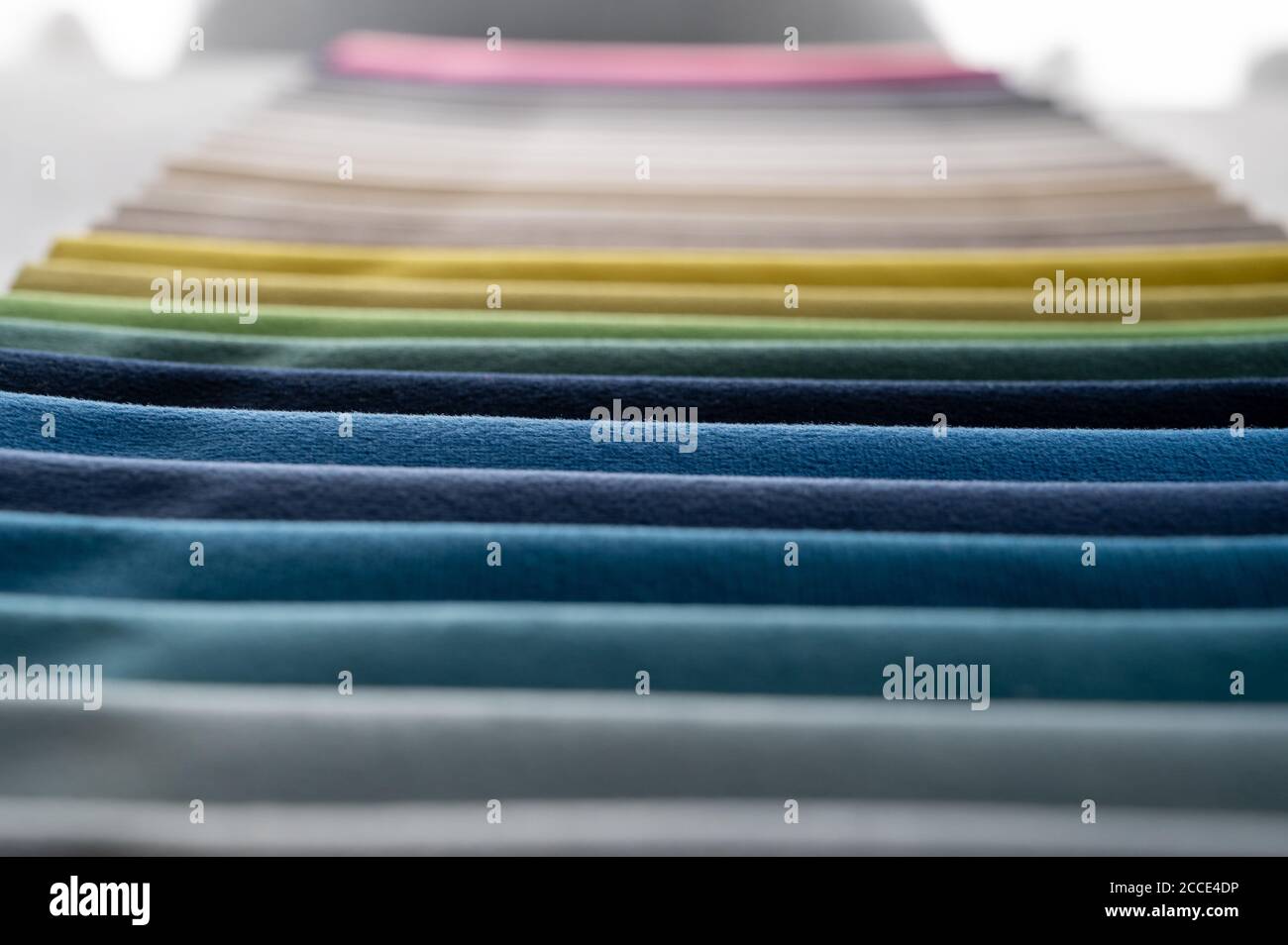 Gradient colored luxury velvet samples folded in rows Stock Photo - Alamy
