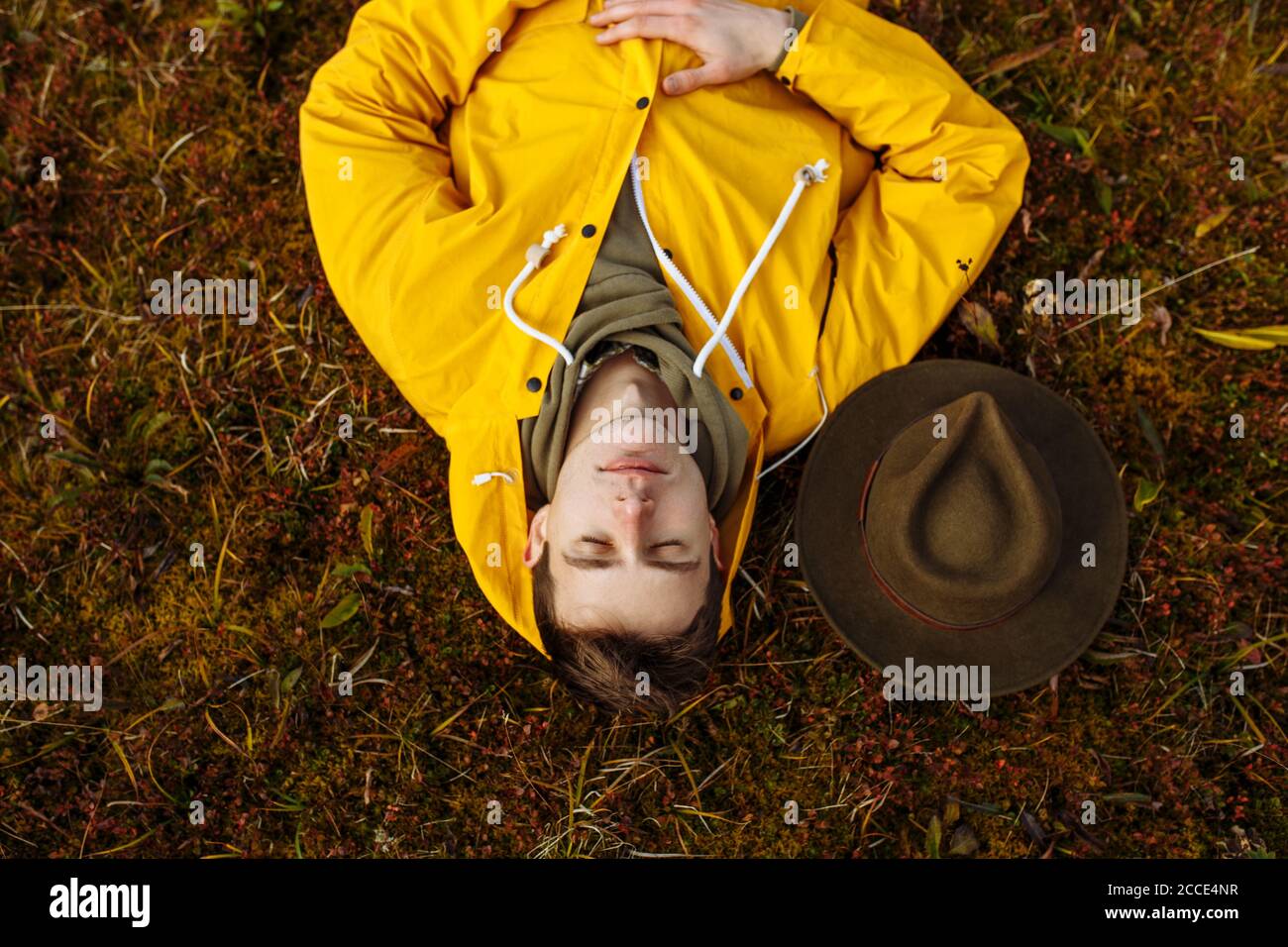 relaxed tourist sleeping on the ground, tourist enjoying the beauty of ...