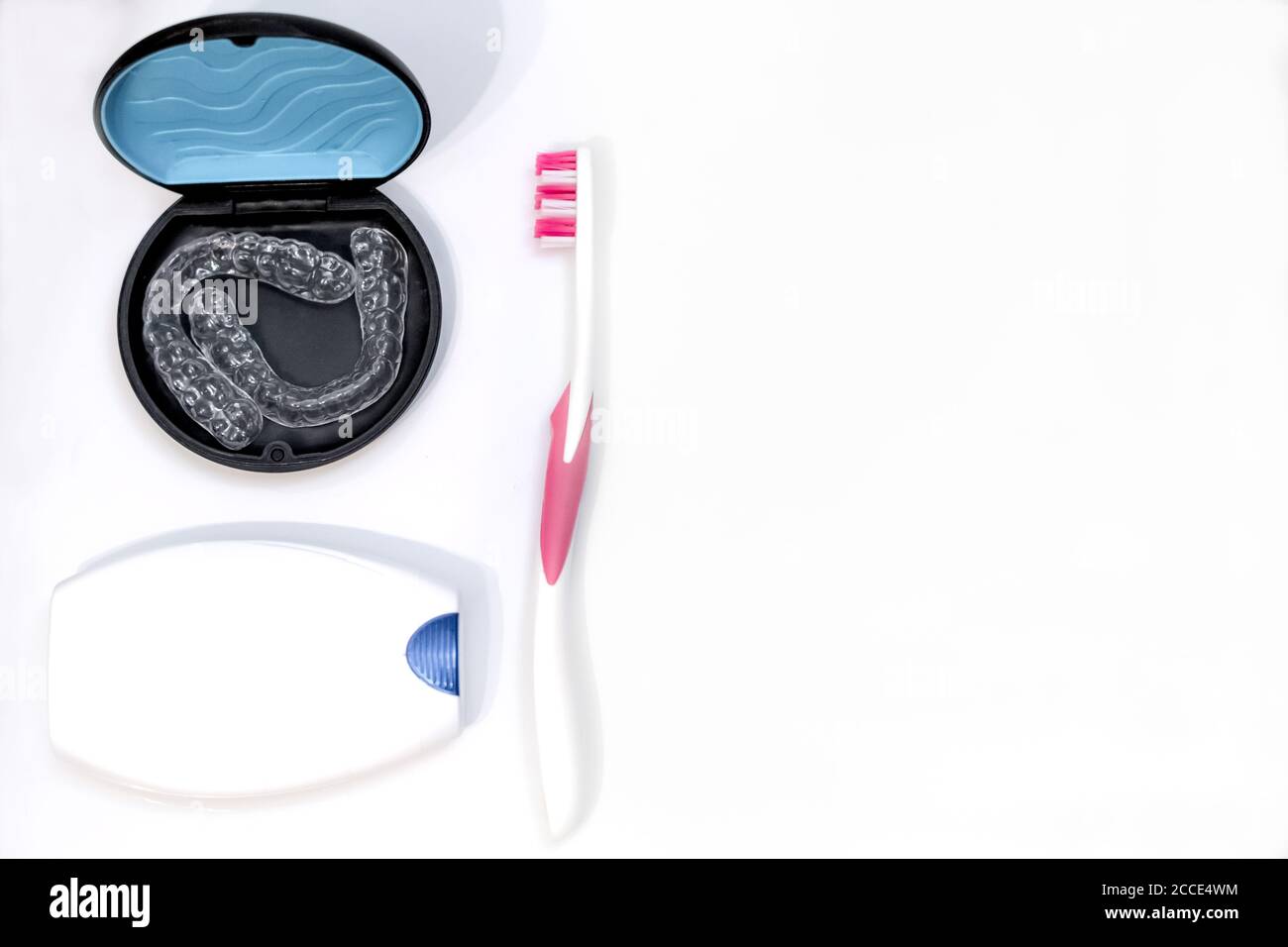 Invisible aligners case, toothbrush and toothpaste Stock Photo - Alamy
