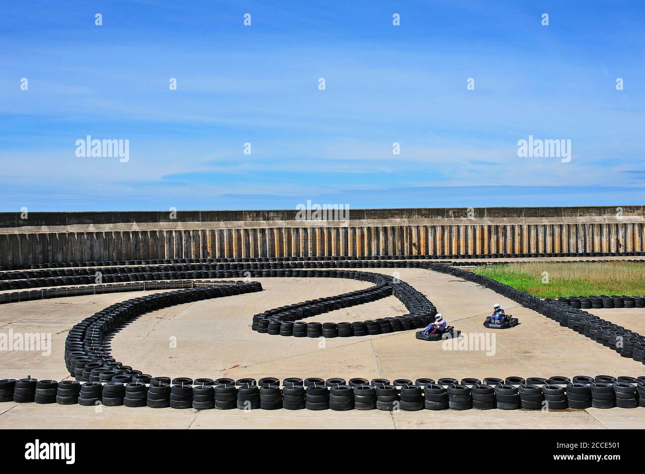 Two go-karts racing around circuit at race track in Blackpool Stock ...