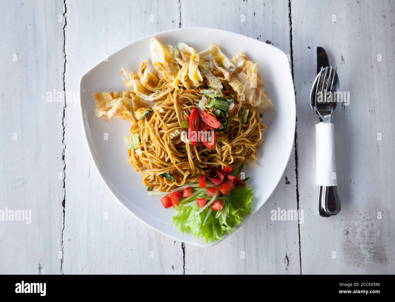 Typical dish, Bami Goreng (fried noodles Stock Photo - Alamy