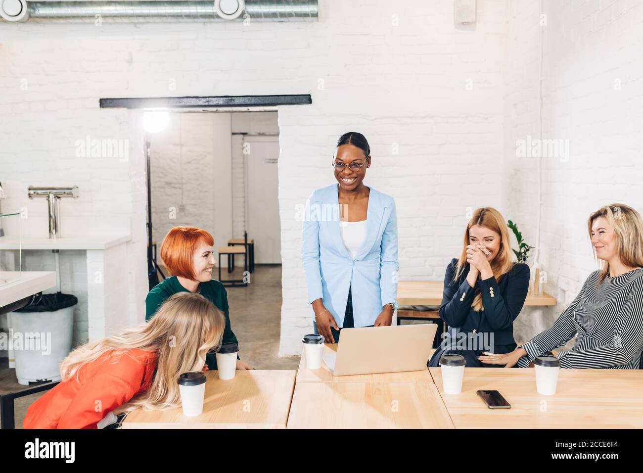 African young beautiful woman in blue formal wear making good first ...