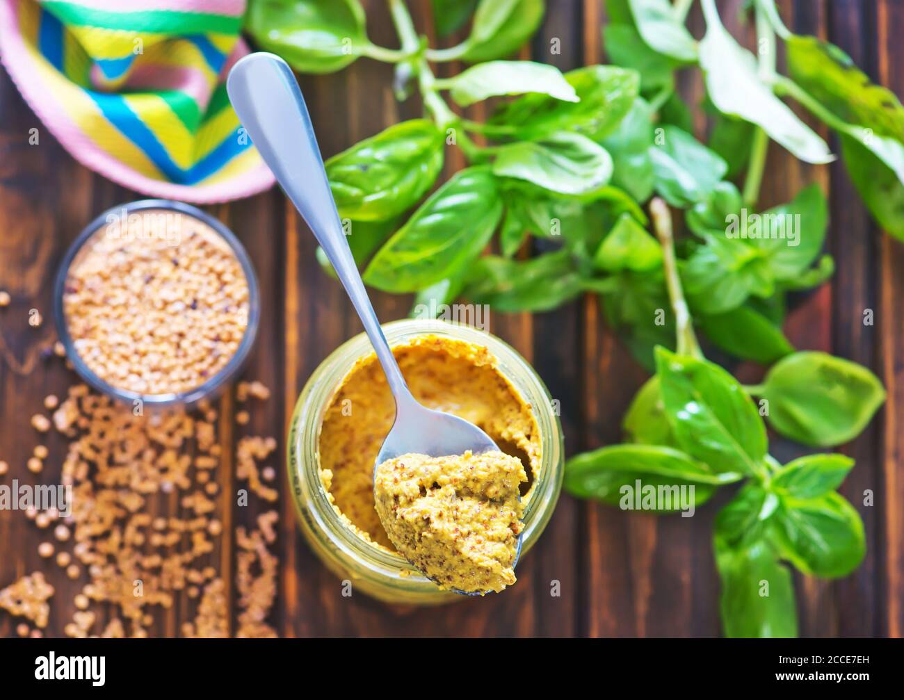 mustard in glass bank and on a table Stock Photo - Alamy