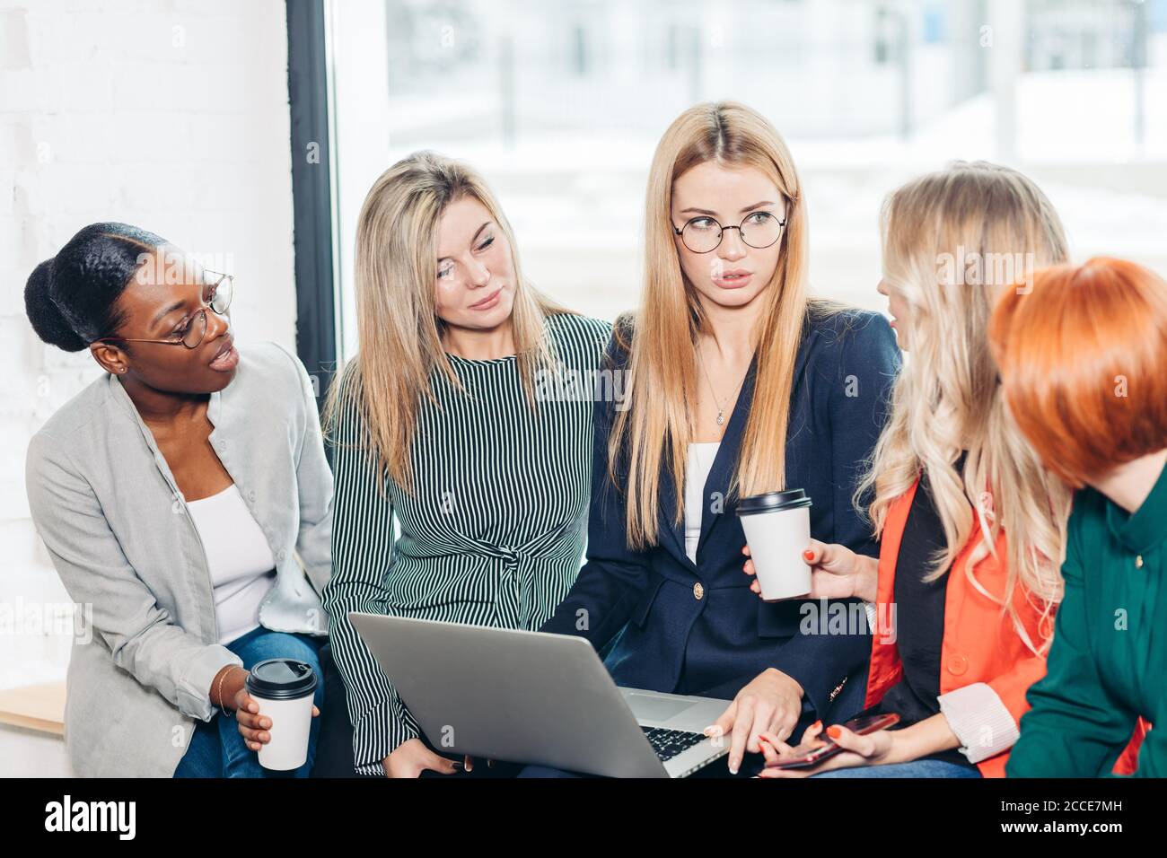International company diverse female business partners sharing their ...