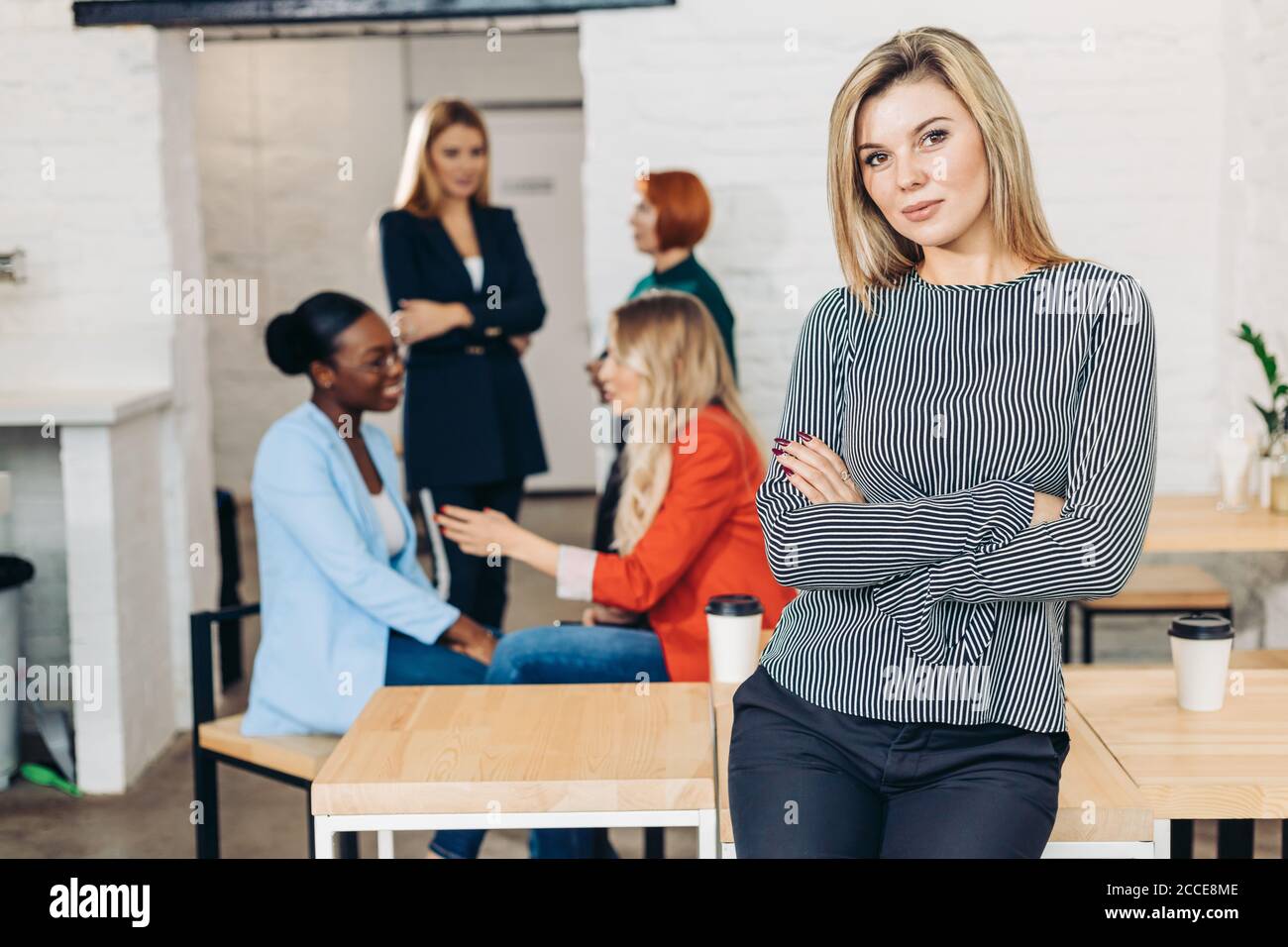 Indoor shot of pleasant-looking caucasian female copywriter, being ...