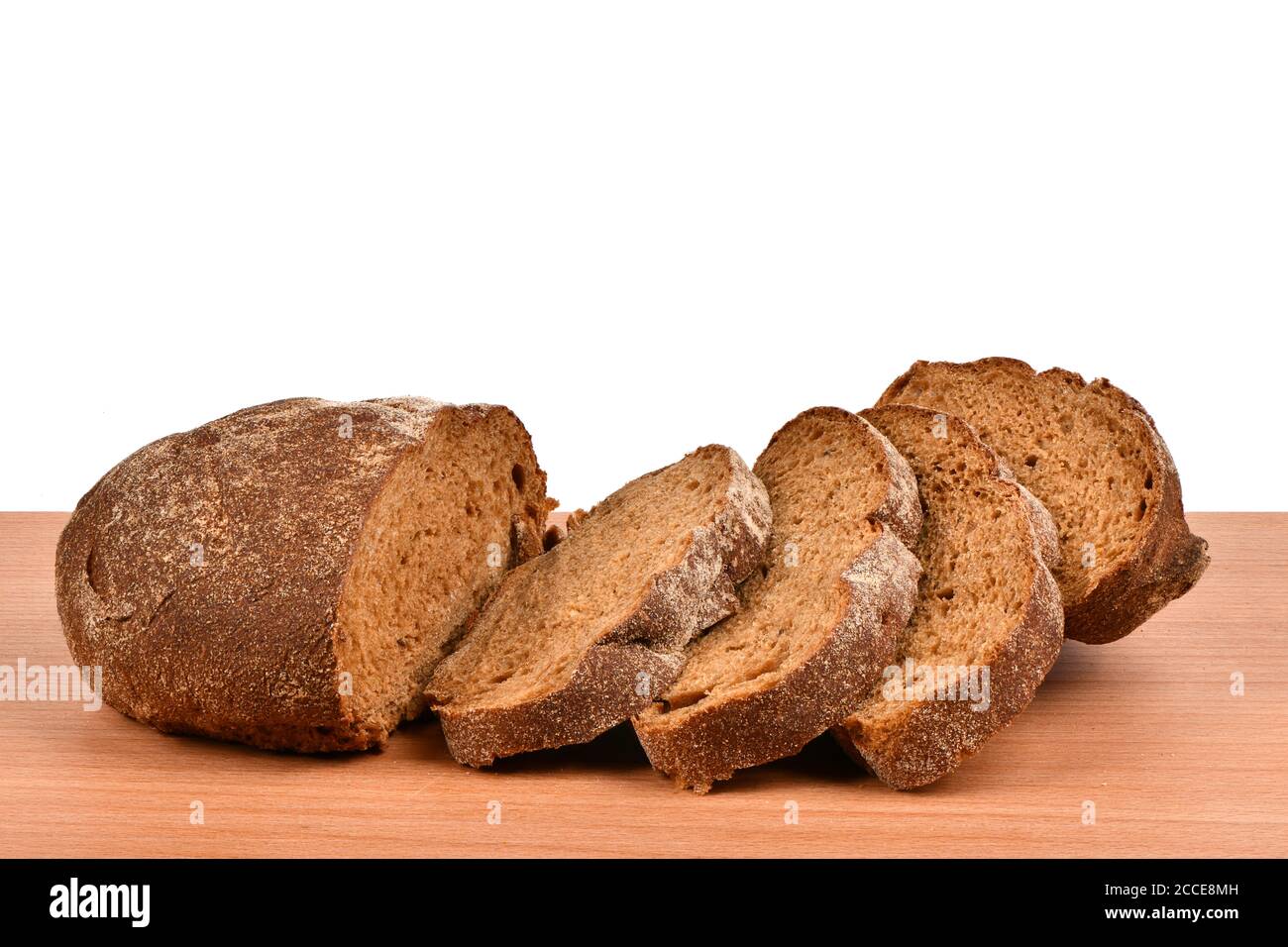 Freshly baked loaves of traditional round rye bread isolated on white ...
