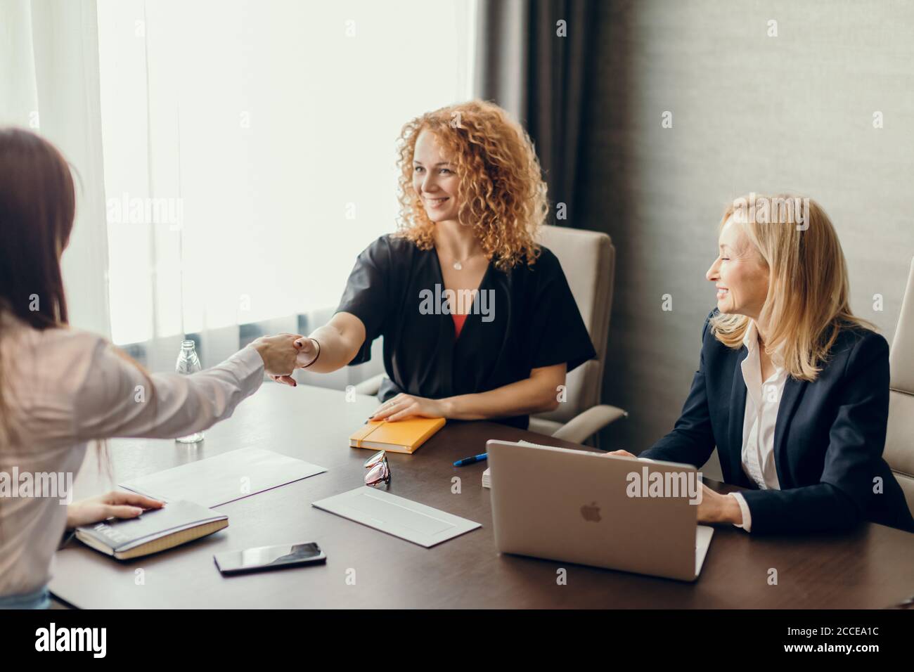 Woman job applicant having an interview with two female corporate ...