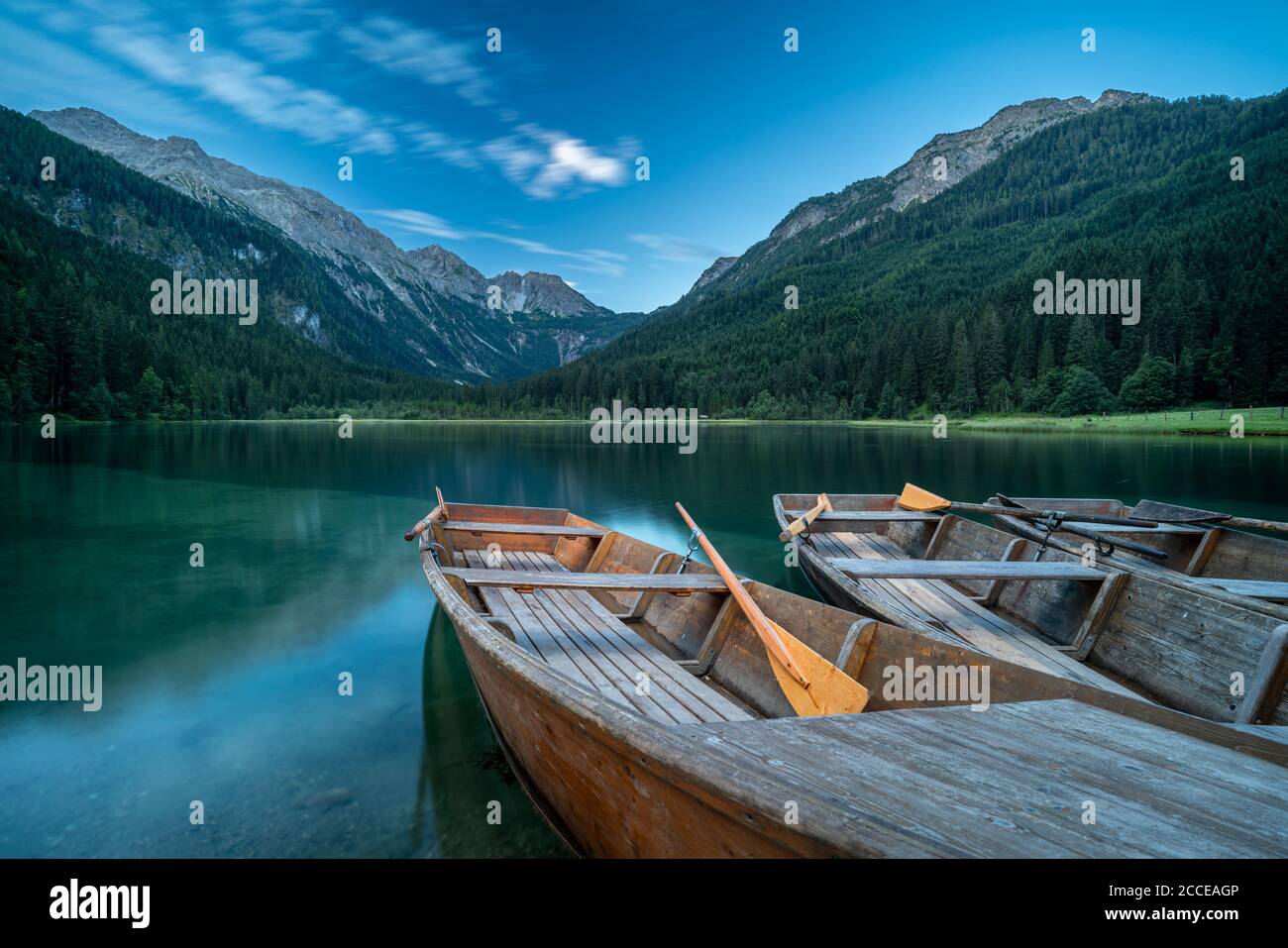 idyllic lake in the mountains with a blue sky with rowing boats Stock ...
